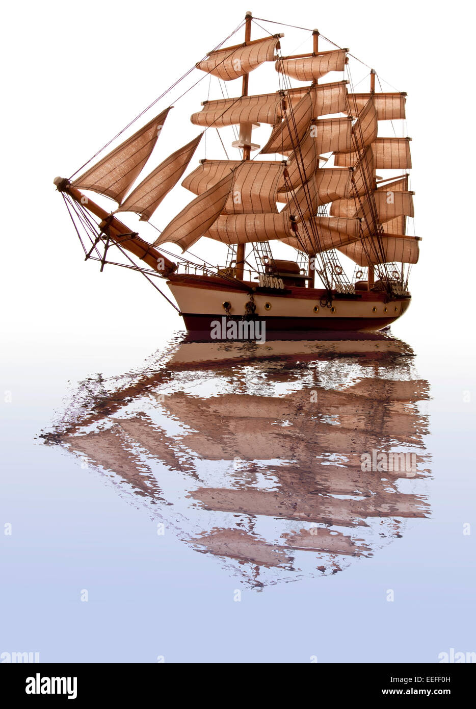 A model of an old clipper on a white background with a reflection in ...