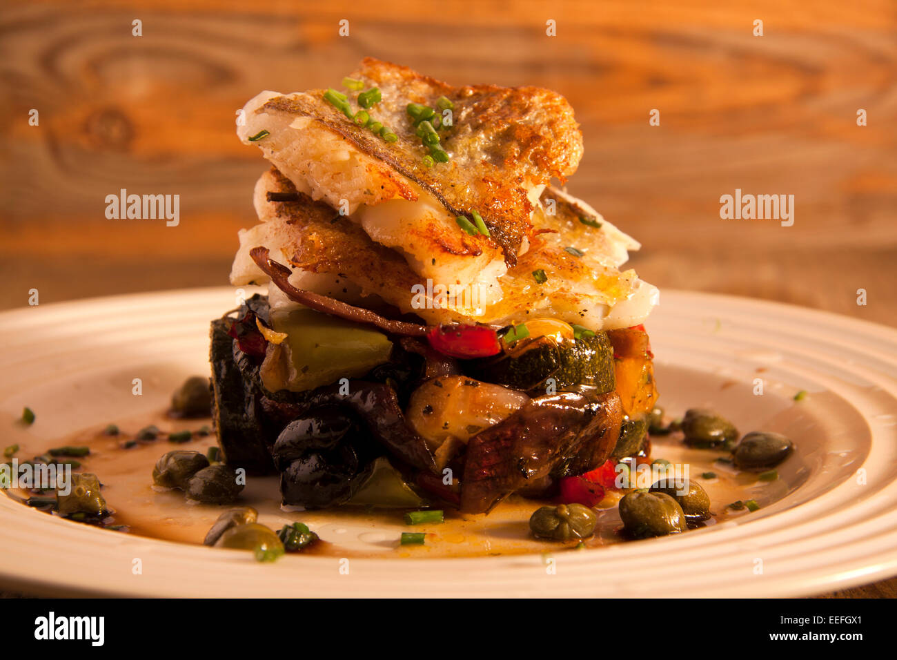 A delicious Mediterranean fish dish made with roasted vegetables and ...