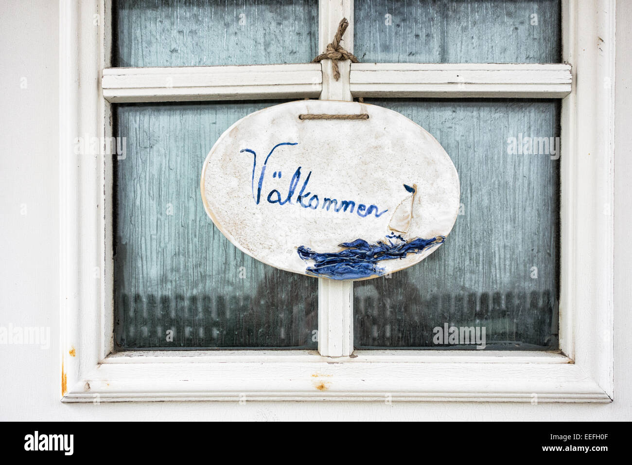 Welcome sign on a window in Sweden Stock Photo - Alamy