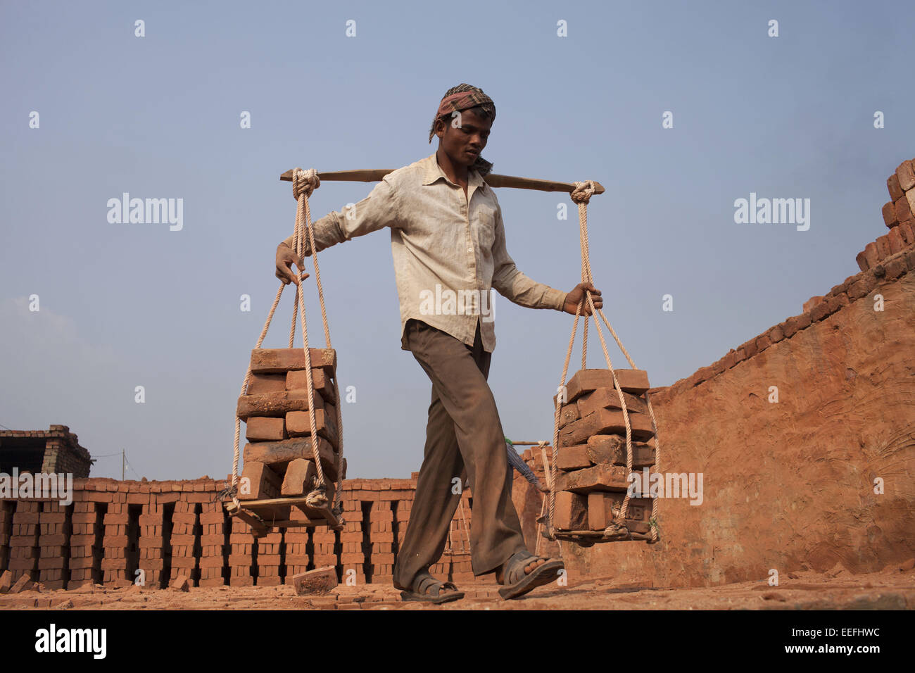 Bangladeshi day labourer works in a brick factory in Dhaka on 17 ...