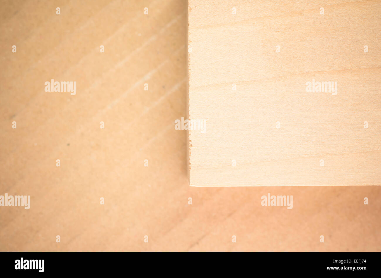 little wood block on a paperboard surface, abstract geometric shapes ...