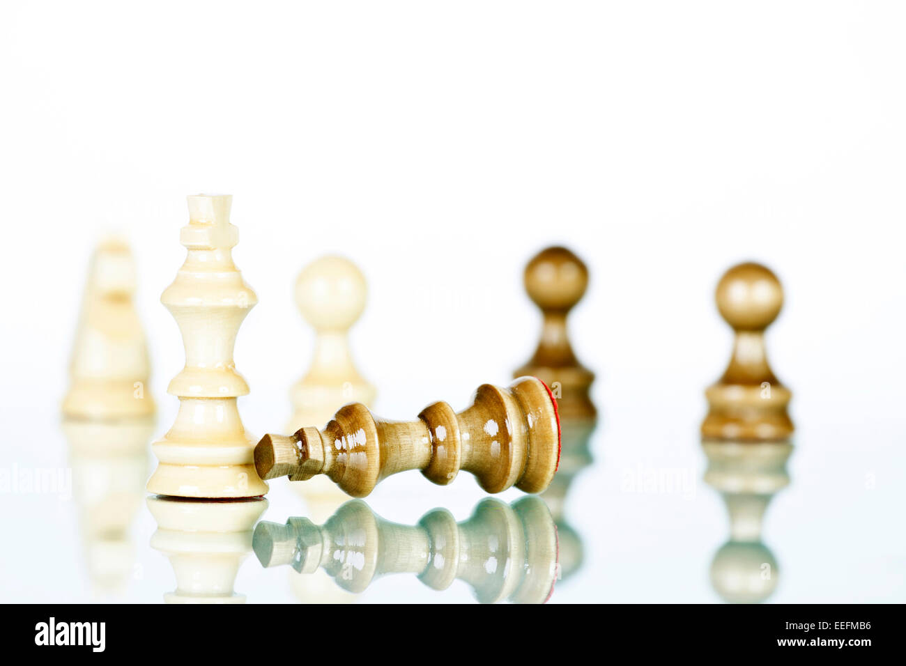 Checkmate - white defeats black on white background Stock Photo - Alamy