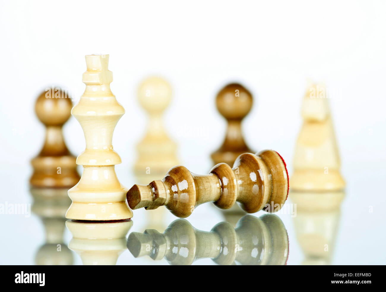 Checkmate - white defeats black on white background Stock Photo - Alamy