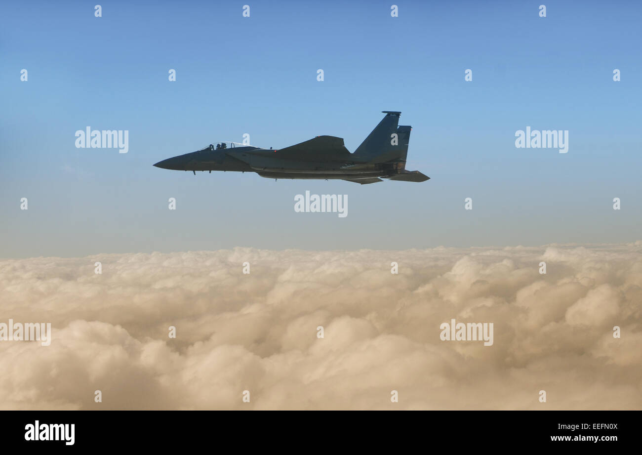 Modern air force fighter jet flying above the clouds F-15 Stock Photo ...