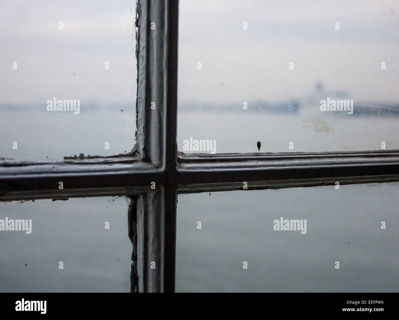 Looking through a window on the end of Hythe Pier towards Southampton ...