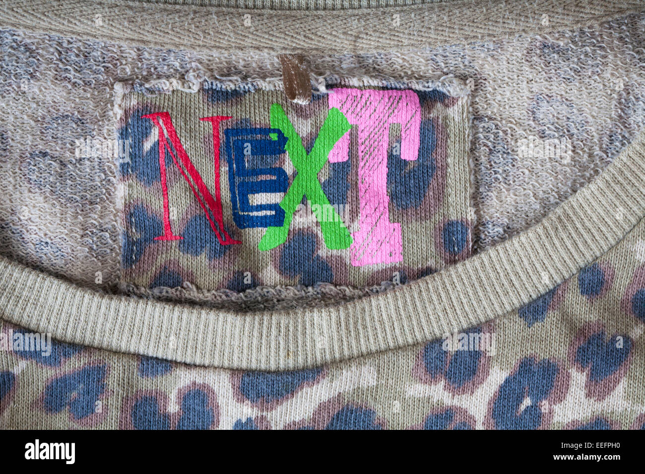 next label in girl's top Stock Photo - Alamy