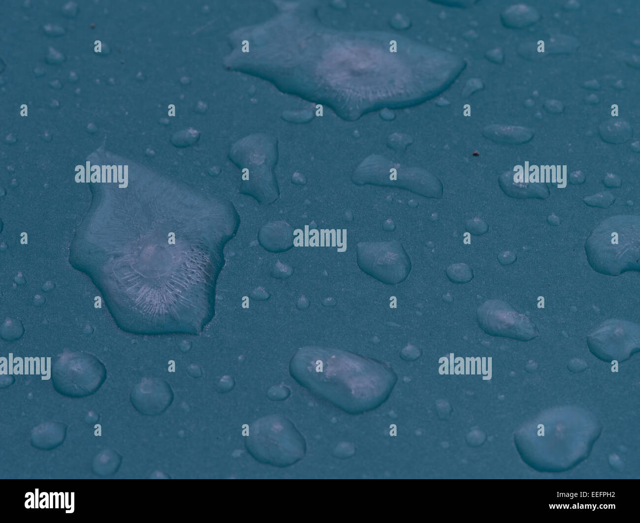 frozen drips on plastic garden box Stock Photo - Alamy