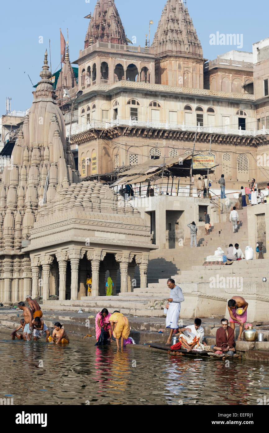 Varanasi, India. Hindus bathing and praying in the Ganges river ...