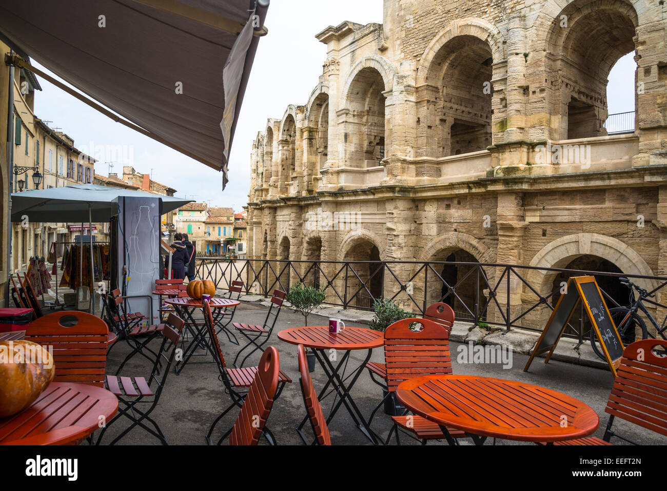 Cafe tables and Roman Amphitheatre, Arles, Bouches-du-Rhone, France ...