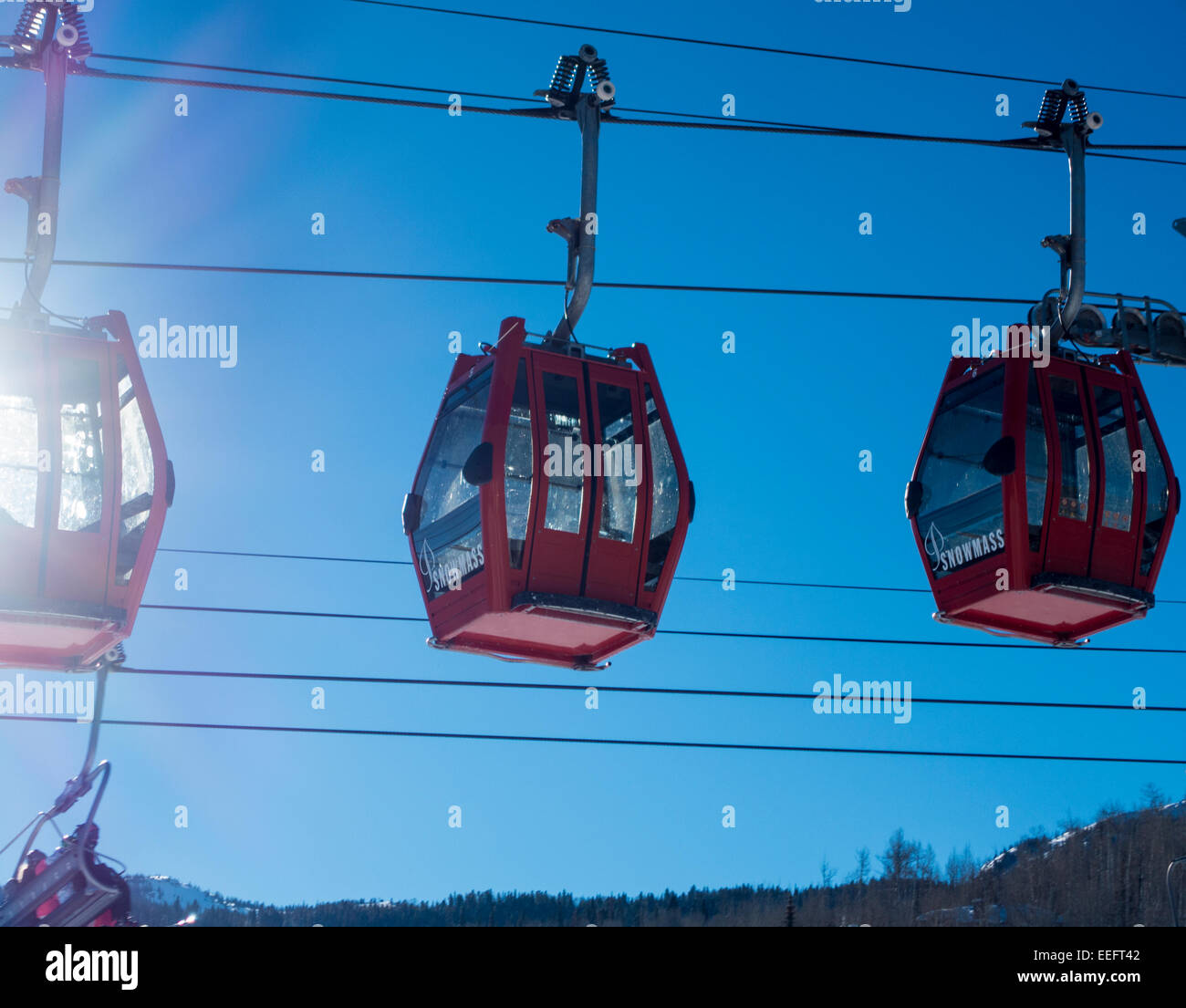 Gondolas above a ski trail Stock Photo - Alamy
