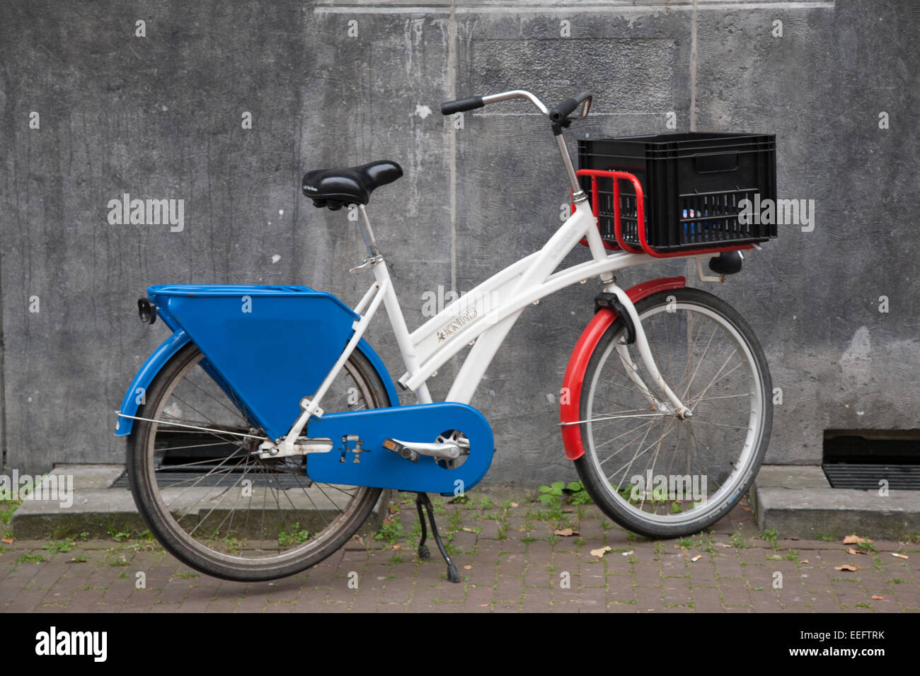 Red, White and Blue Bicycle in Street in Amsterdam, Holland Stock Photo ...