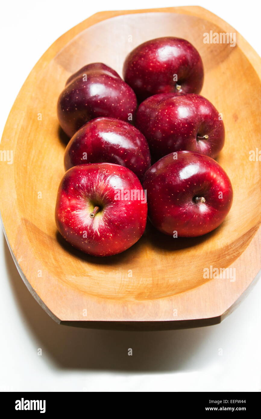 Red apples in a wooden bowl Stock Photo - Alamy