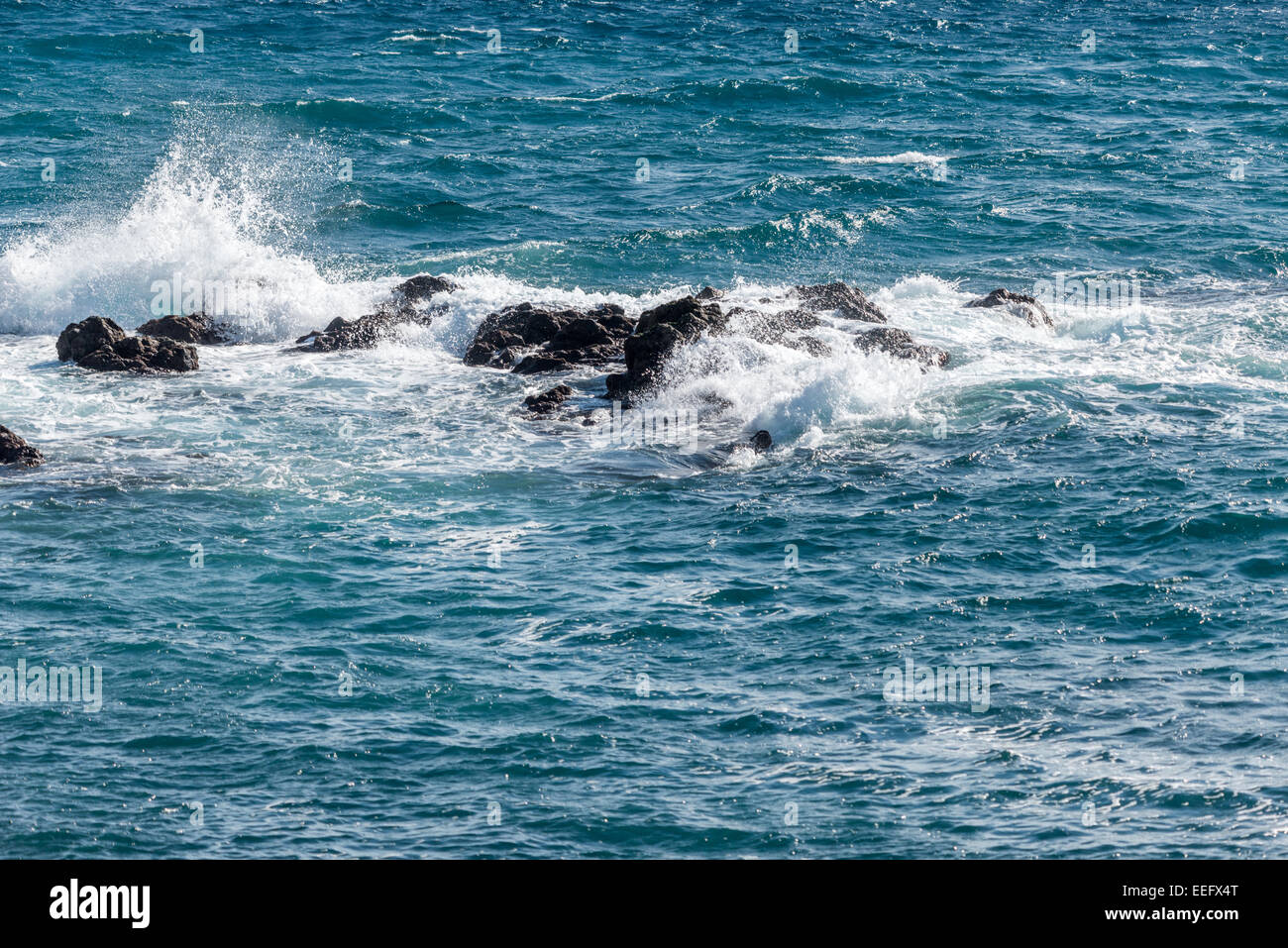Rocks in the Ocean Stock Photo - Alamy