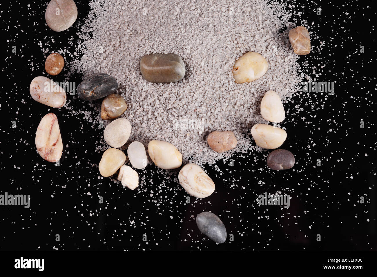 decorative stones buried in sand Stock Photo - Alamy