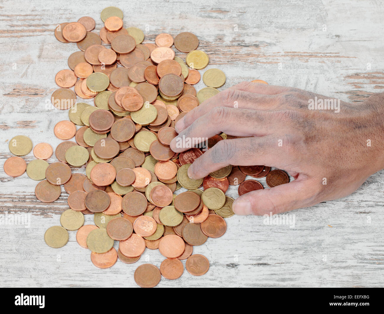 a poor hands taking some coins Stock Photo - Alamy