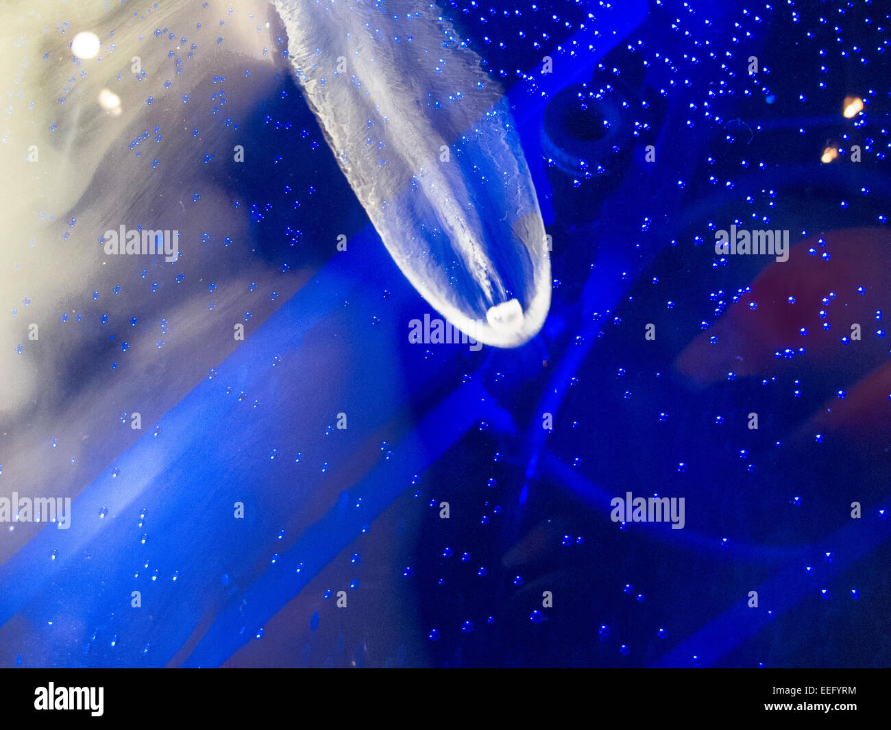 Dry ice particles move in liquid creating interesting wavy patterns ...