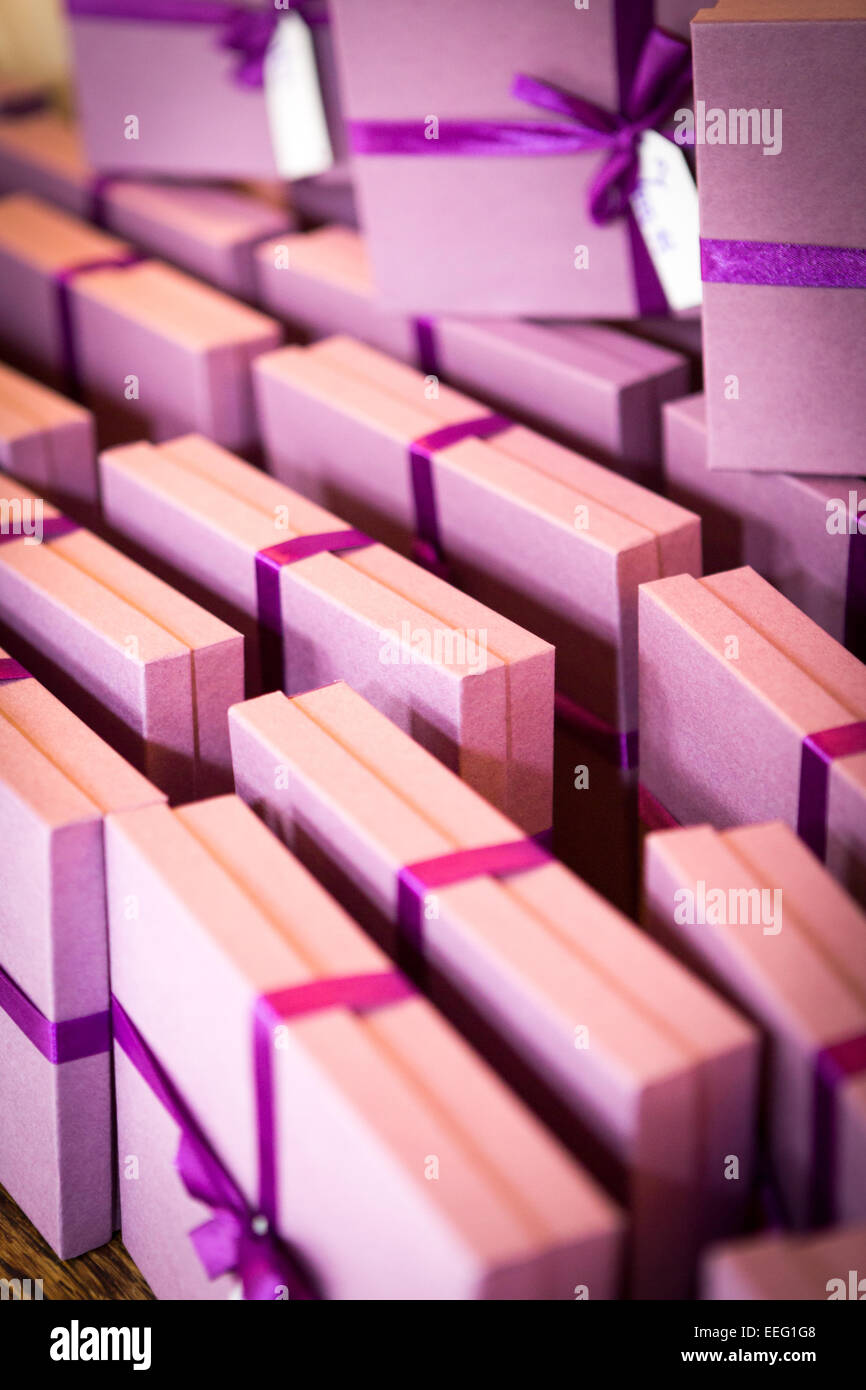 Collection of purple gift boxes with purple ribbon Stock Photo - Alamy