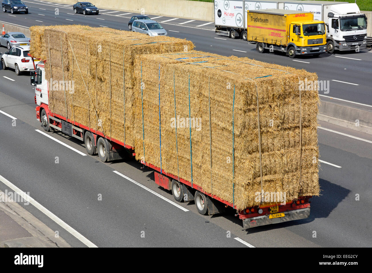 Back and side view of towed trailer & flatbed hgv lorry truck laden ...