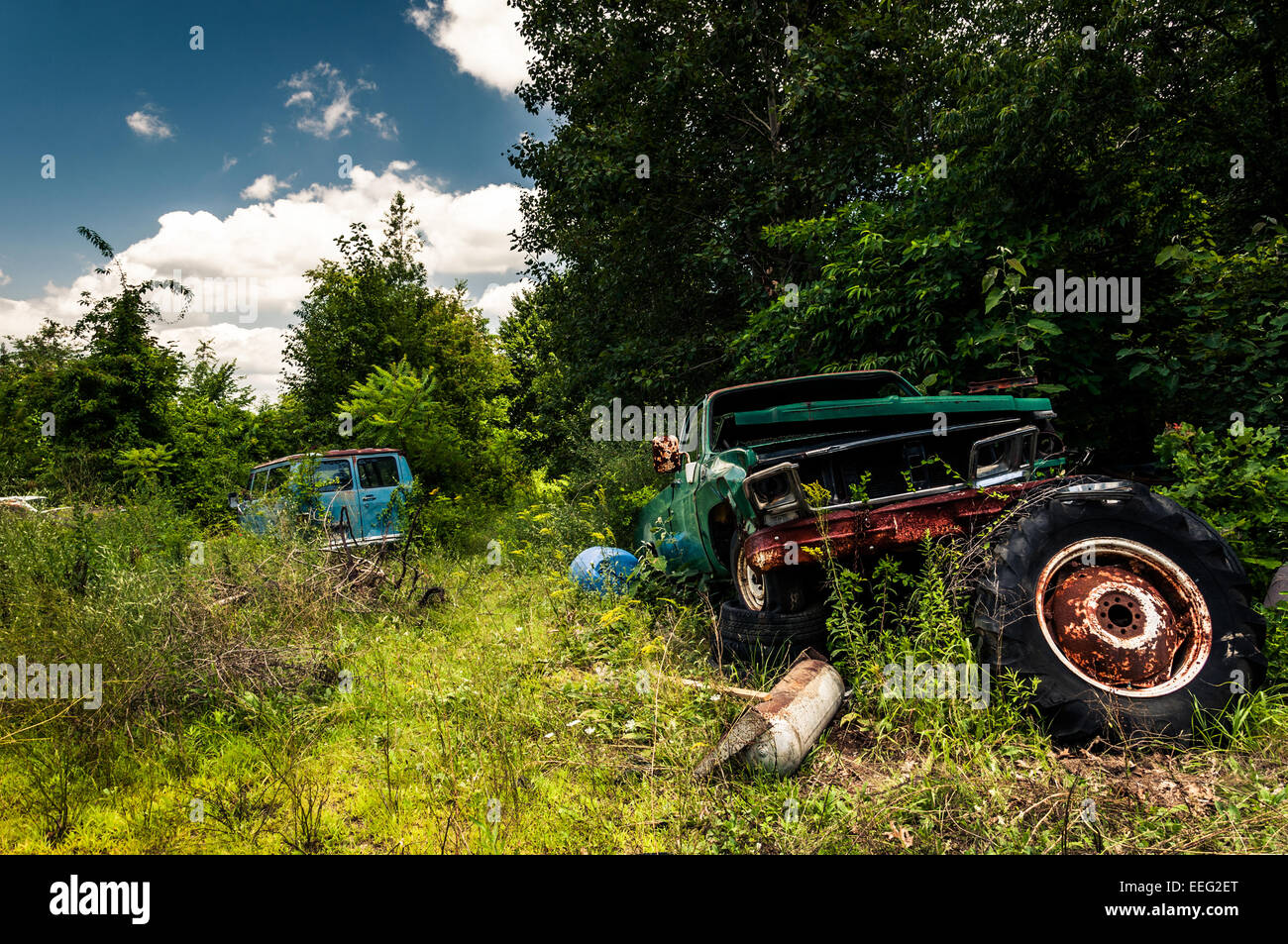 Old van and truck in a junkyard Stock Photo - Alamy