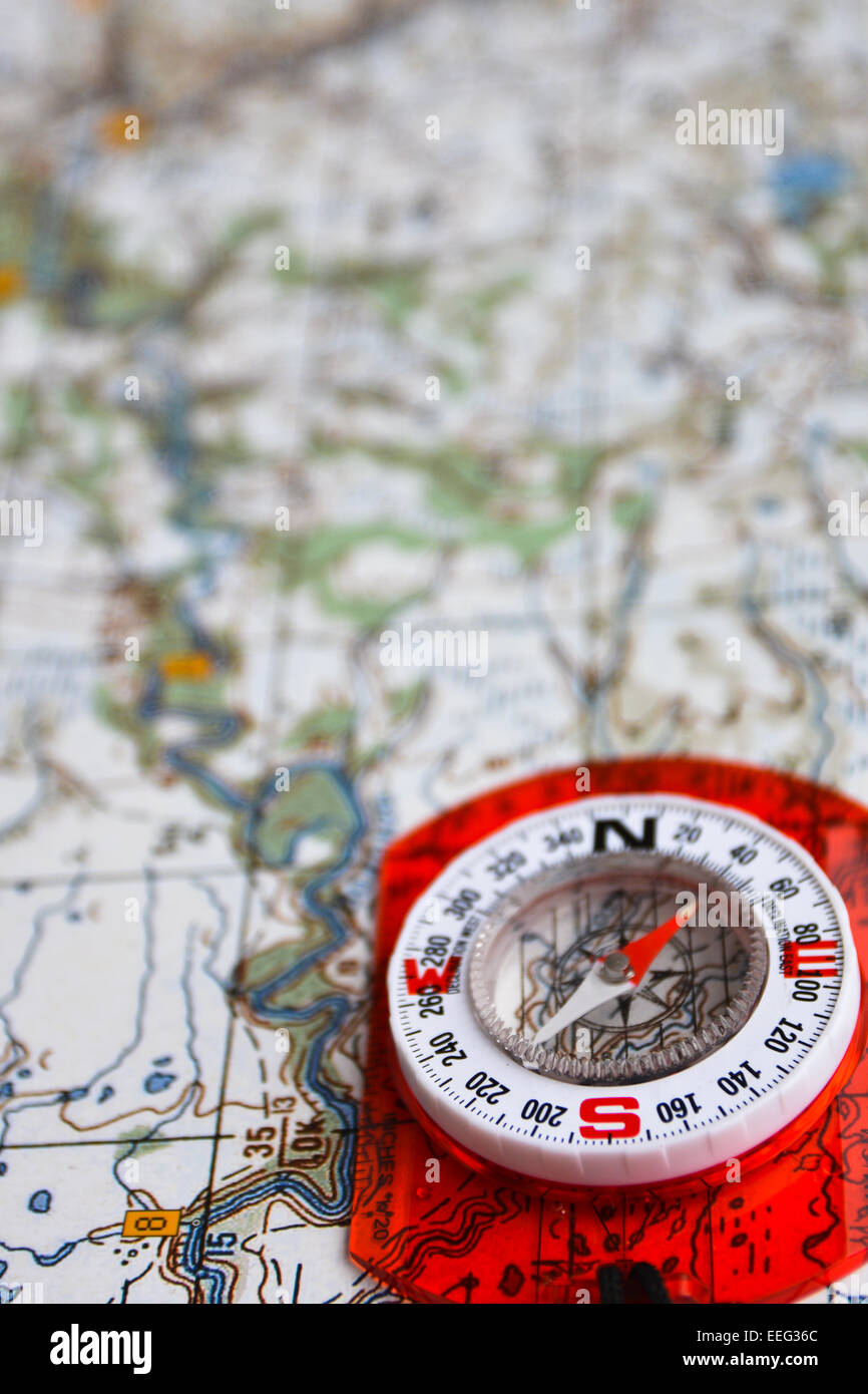 The magnetic compass is located on a topographic map. Equipment for ...