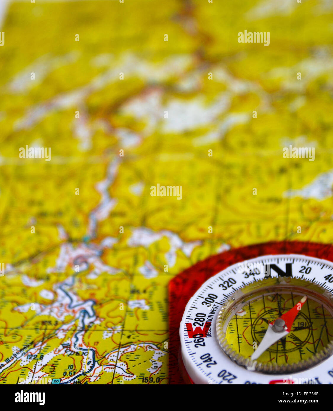 The magnetic compass is located on a topographic map. Equipment for ...