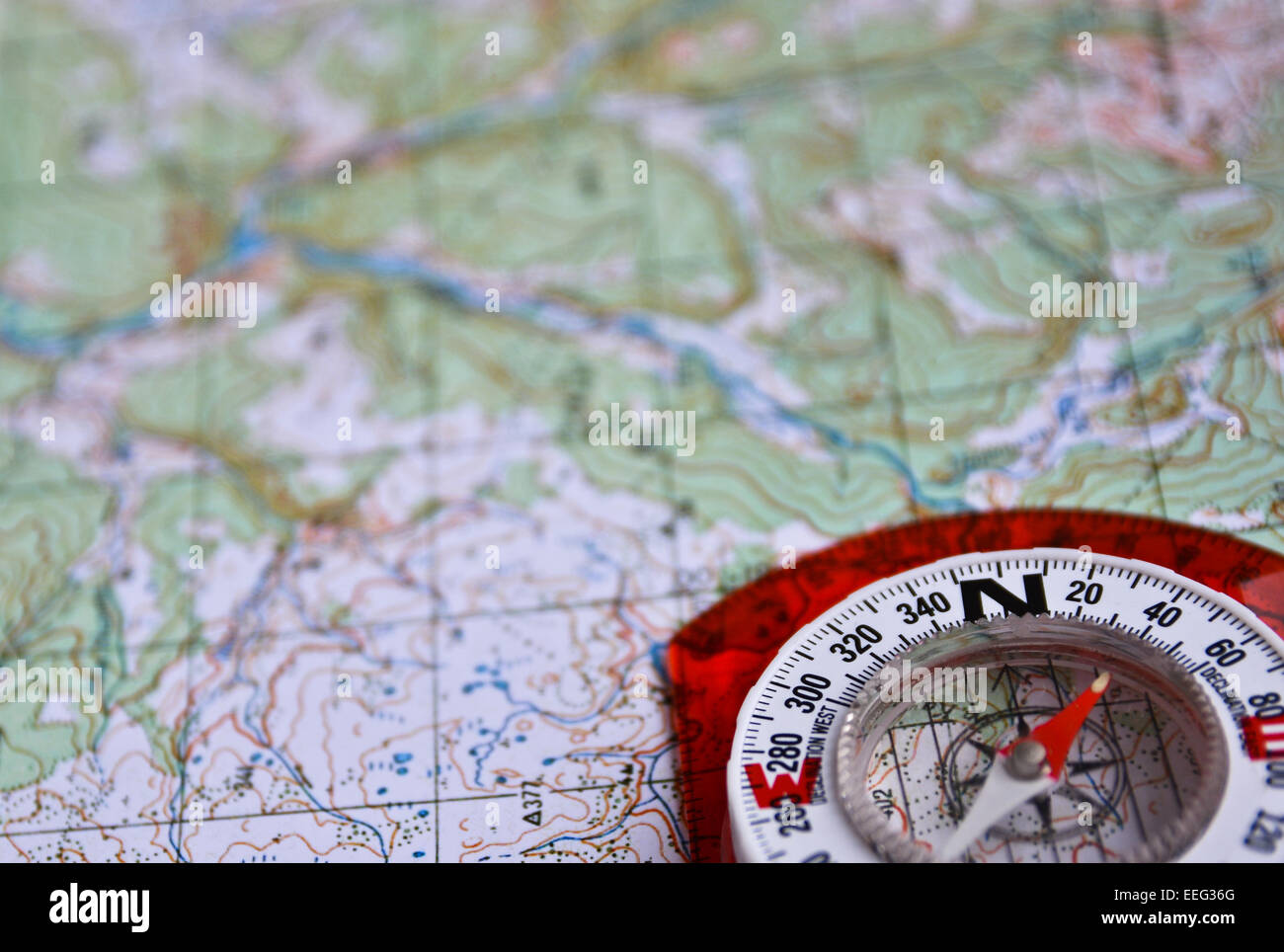The magnetic compass is located on a topographic map. Equipment for ...