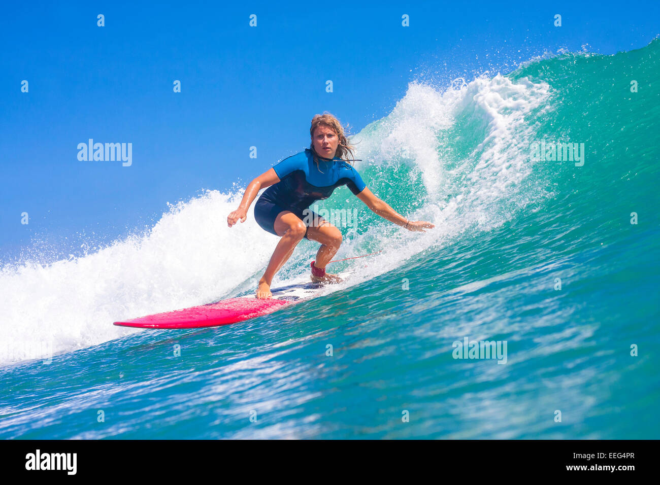 Surfer girl on wave indonesia hi-res stock photography and images - Alamy