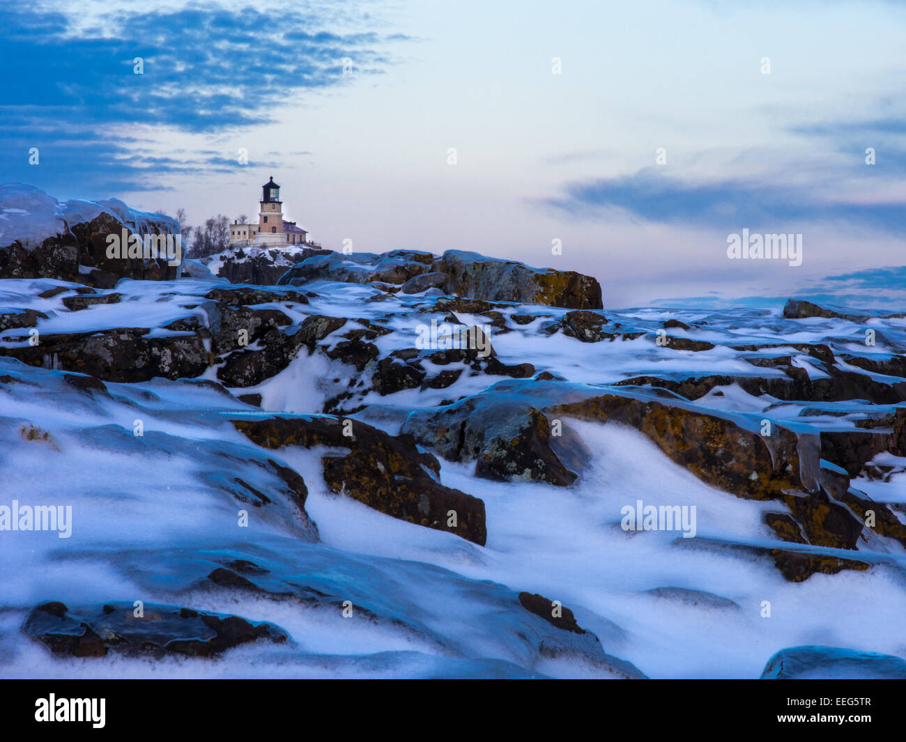 Split Rock Lighthouse glows under the moon on the shore of Lake ...