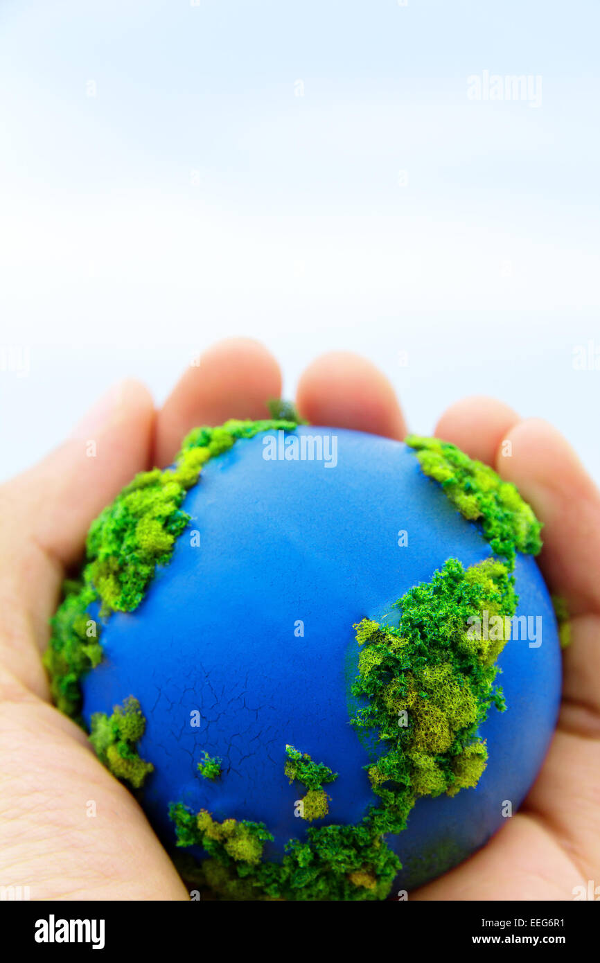 Hands and Earth Stock Photo - Alamy