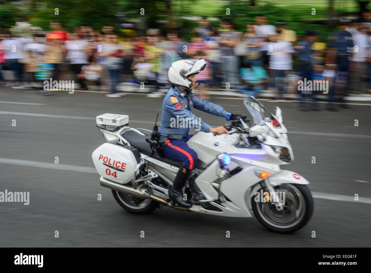 Manila, Philippines, 16th Jan 2015. A motorcycle policeman patrols the ...