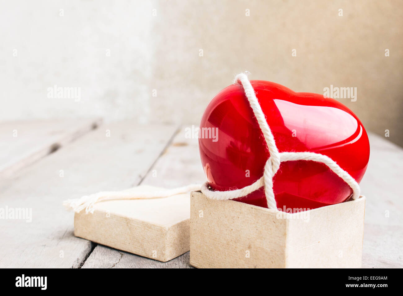 Hearts tied with a rope in box Stock Photo - Alamy