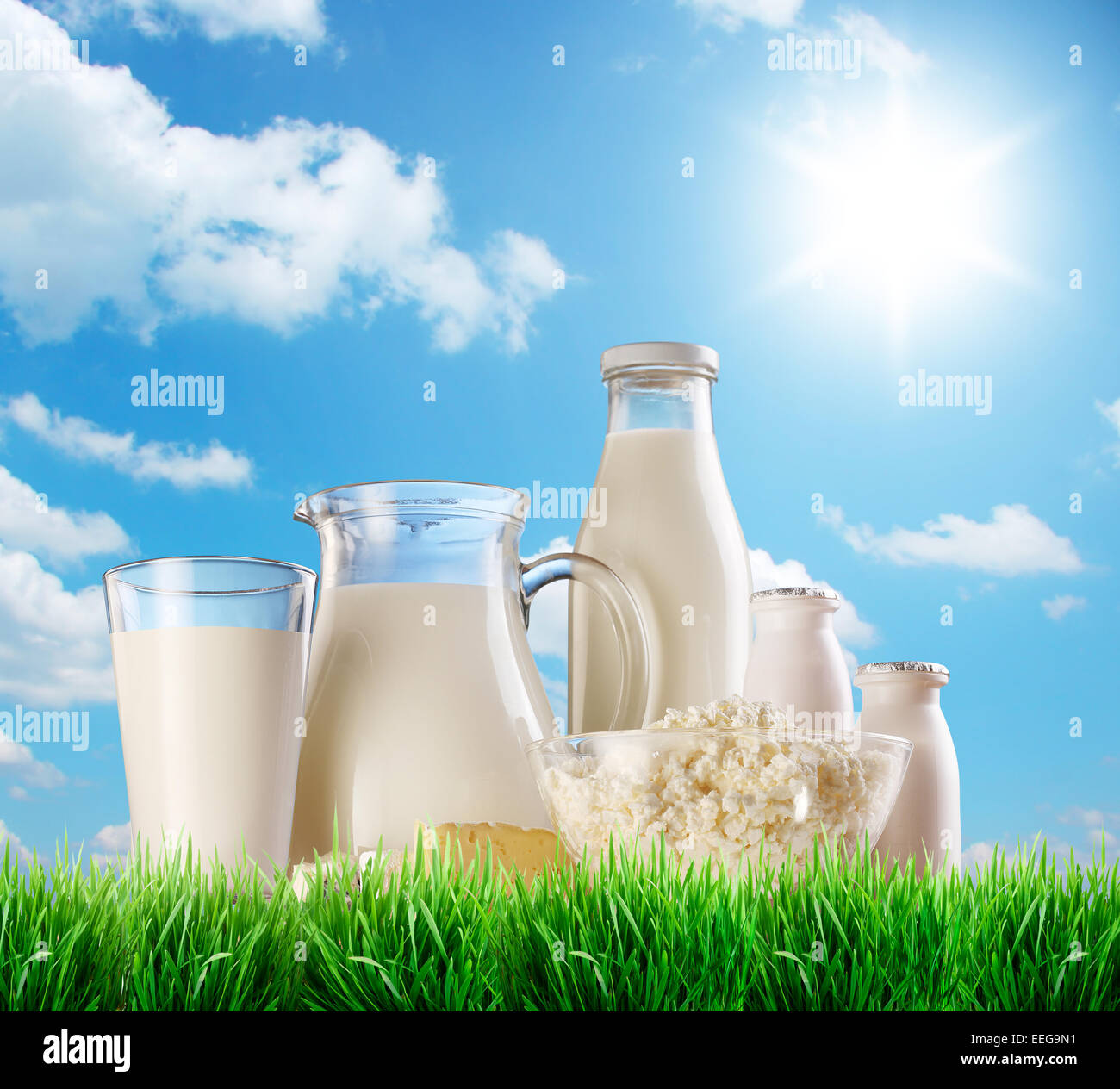 Dairy products on the grass. Background - sunny skies Stock Photo - Alamy