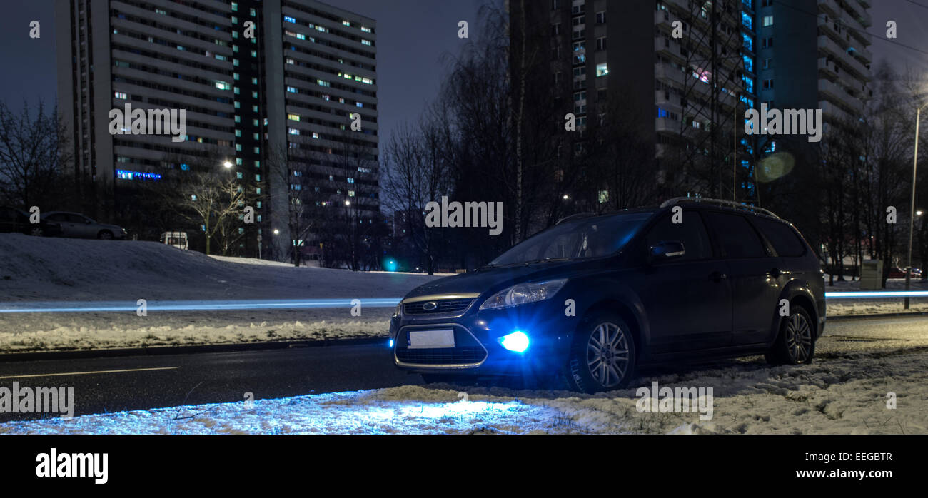 Blu Car in city at night Stock Photo - Alamy