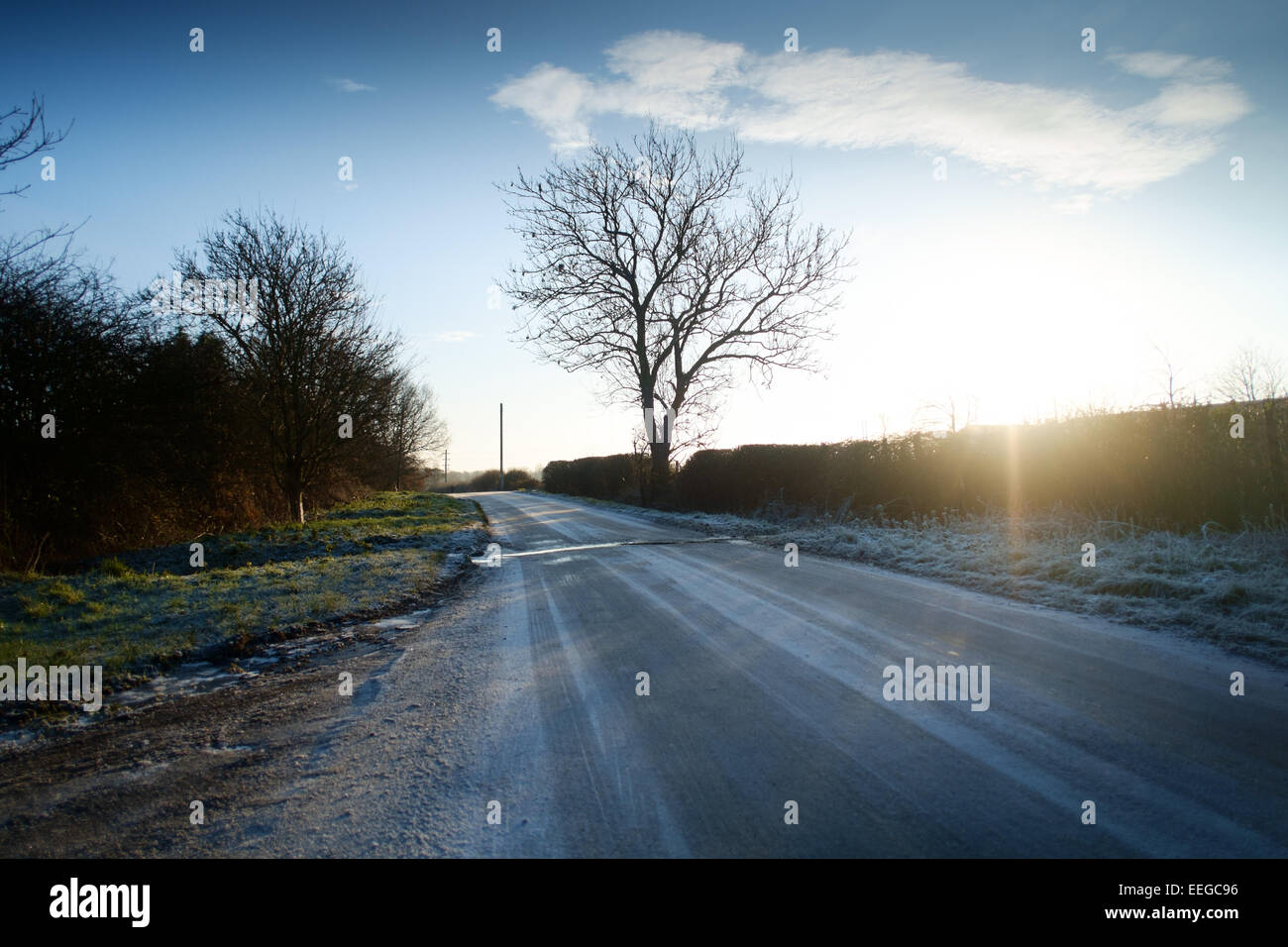 Winter road in the countryside at sunset Stock Photo - Alamy