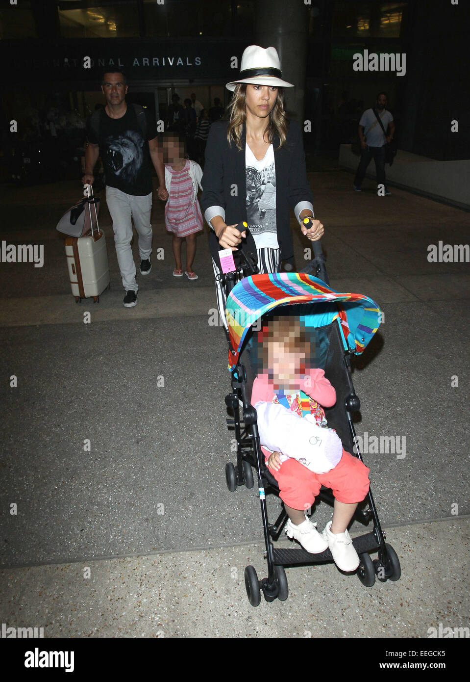 Jessica Alba arriving at Los Angeles International Airport (LAX) with ...