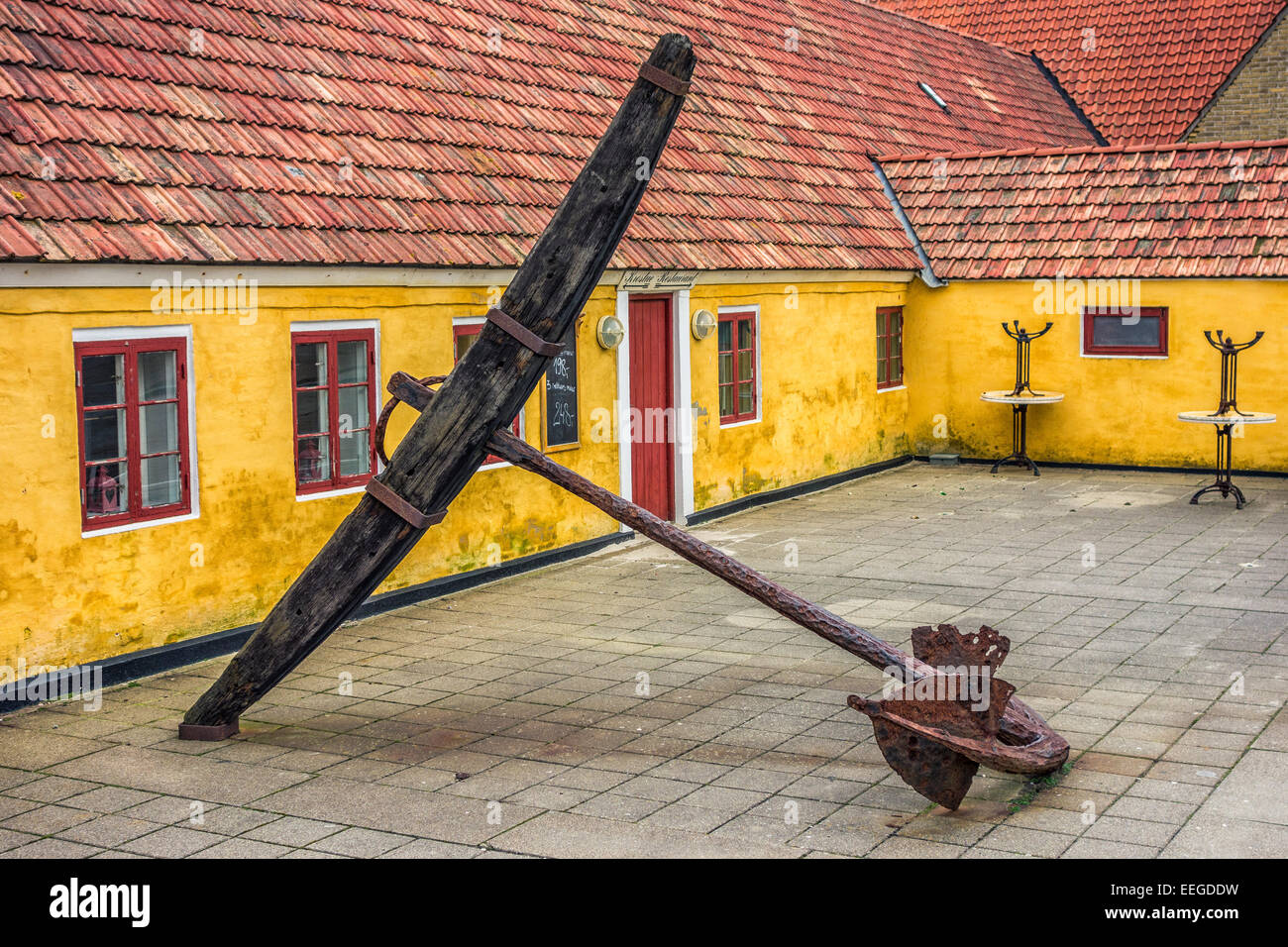 Anchor in front of a building Stock Photo - Alamy