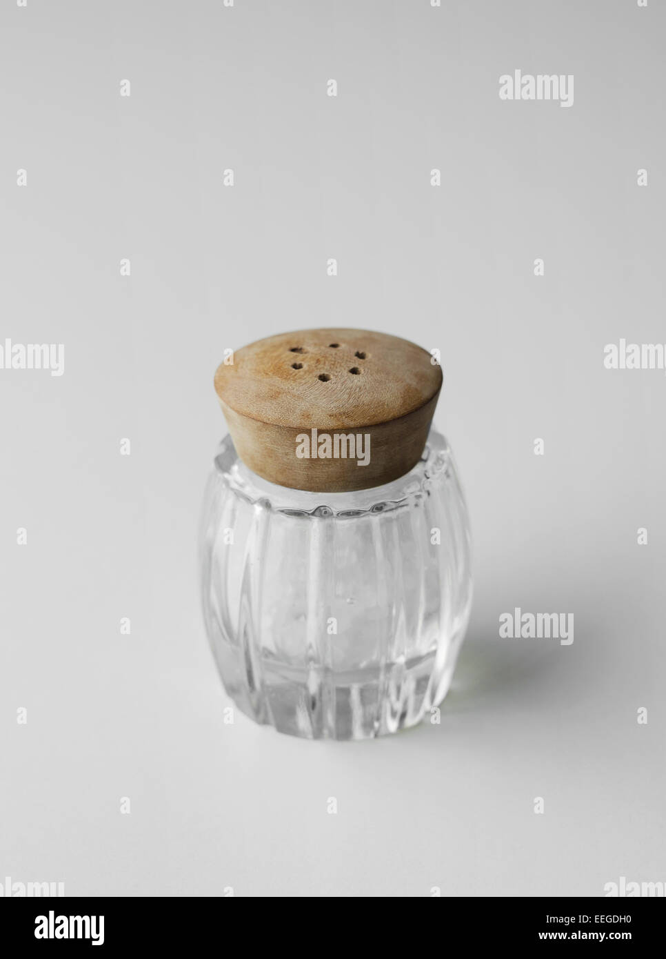Close up of a rustic salt shaker over white background Stock Photo - Alamy
