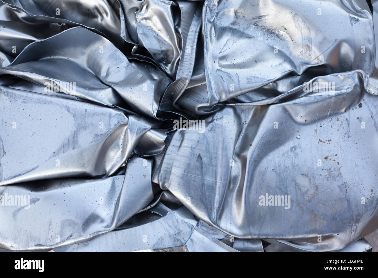 closeup of compressed metal in recycling junkyard. abstract background ...