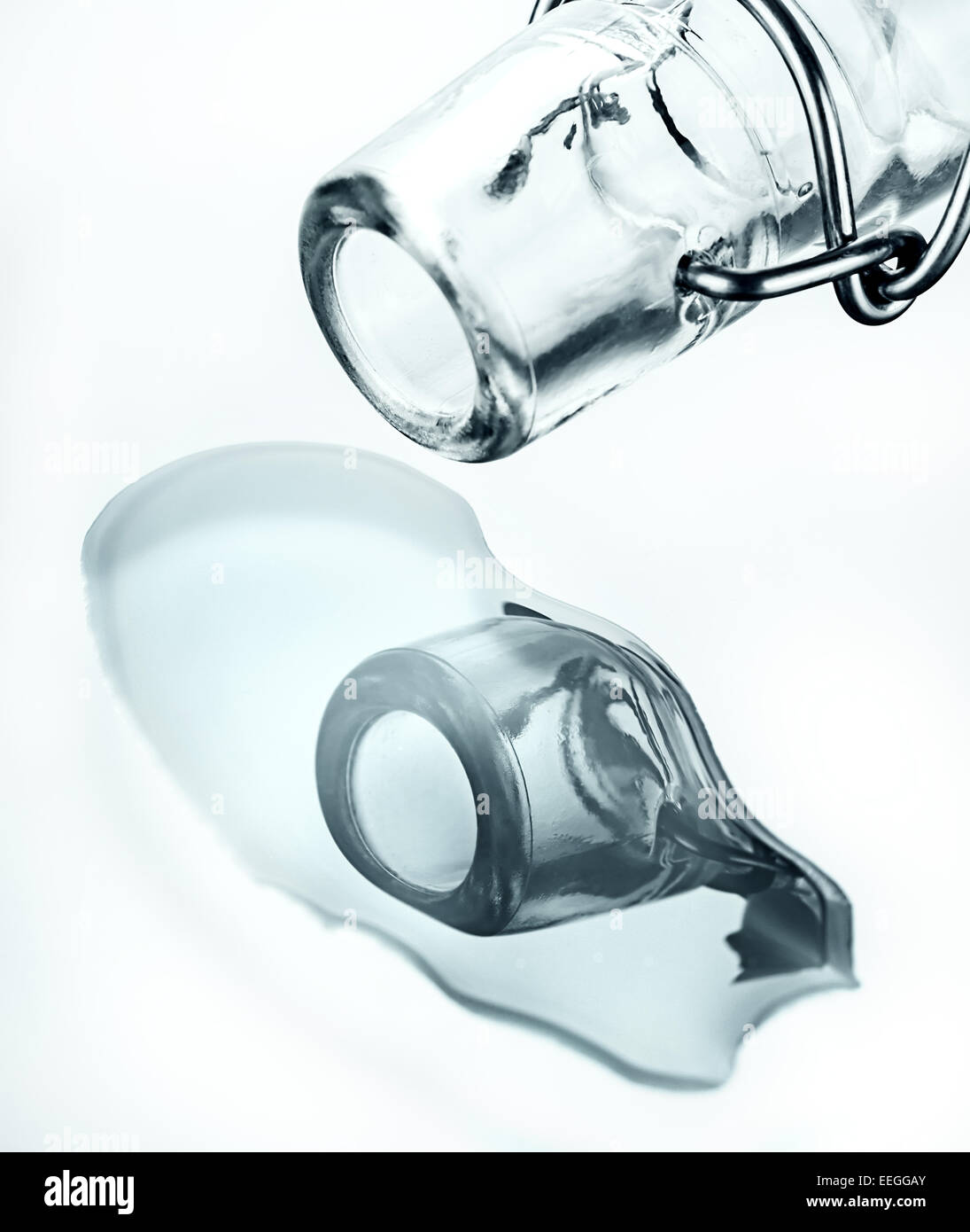 last drop of empty water bottle on white background Stock Photo - Alamy