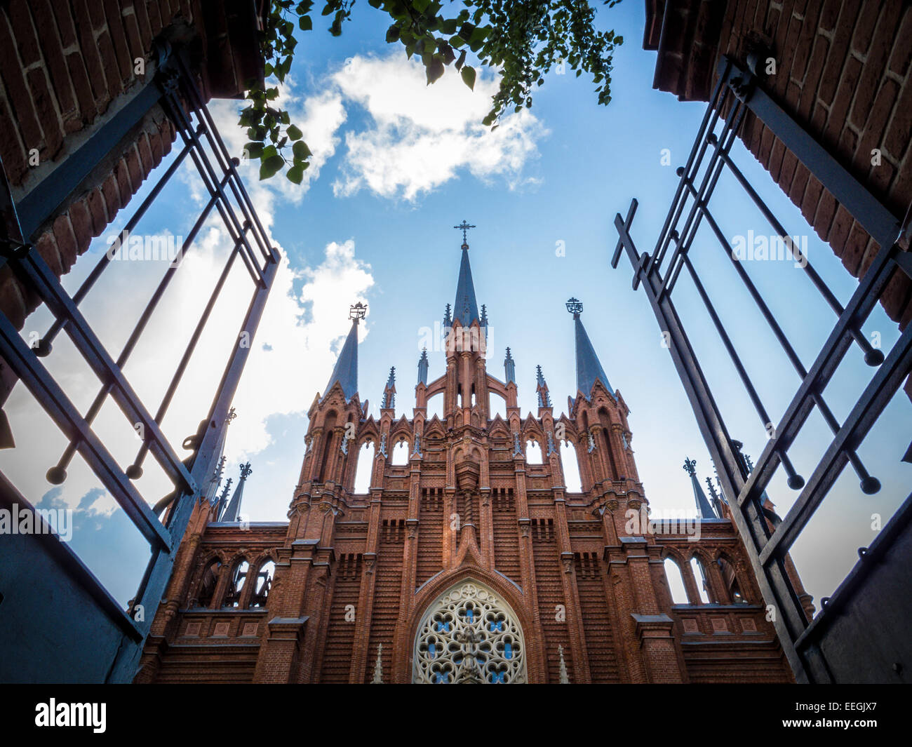 Open metallic gate towards an old Christian church with impressive ...