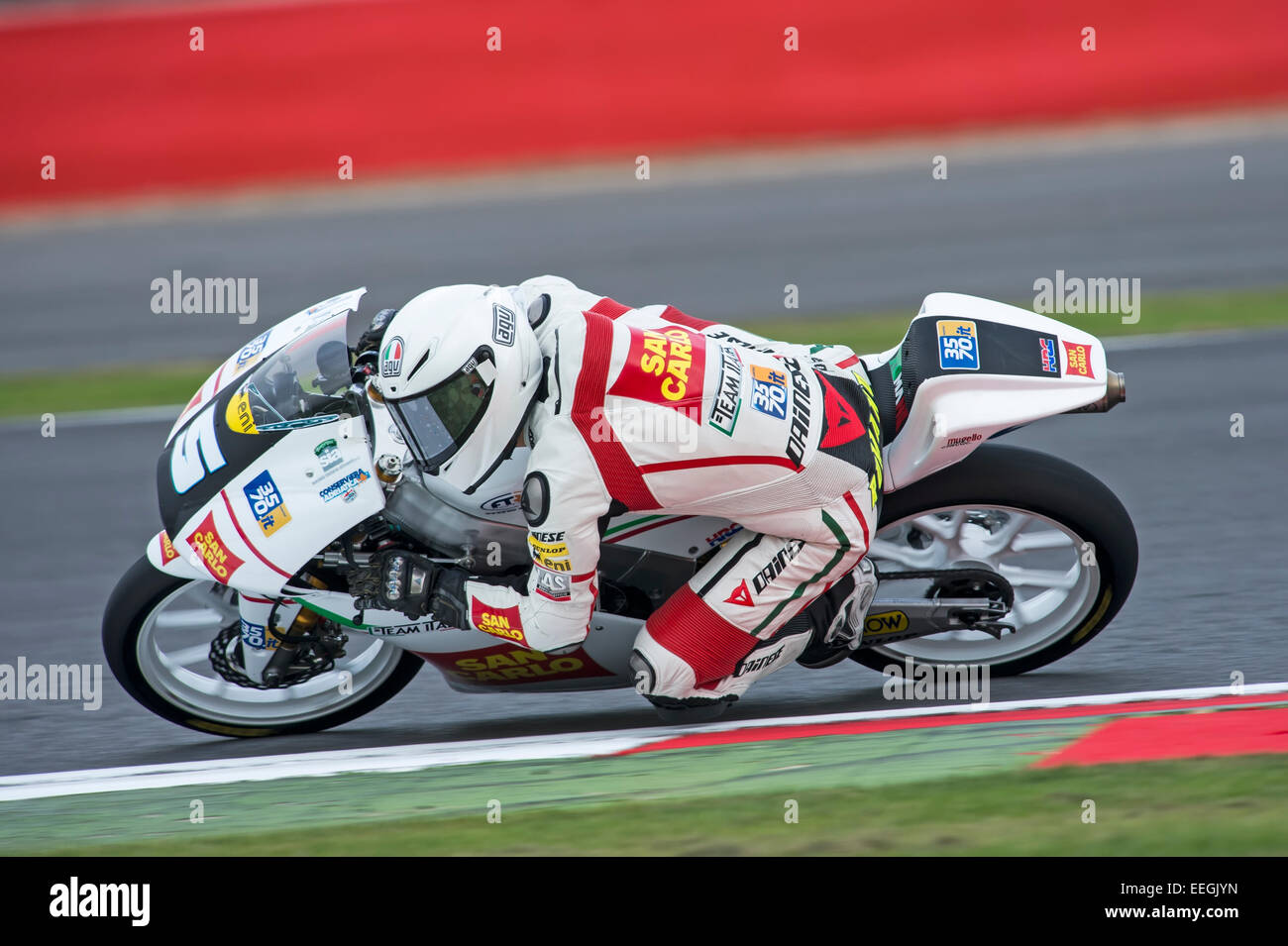 Motorcycle rider with his knee down in a corner hi-res stock ...