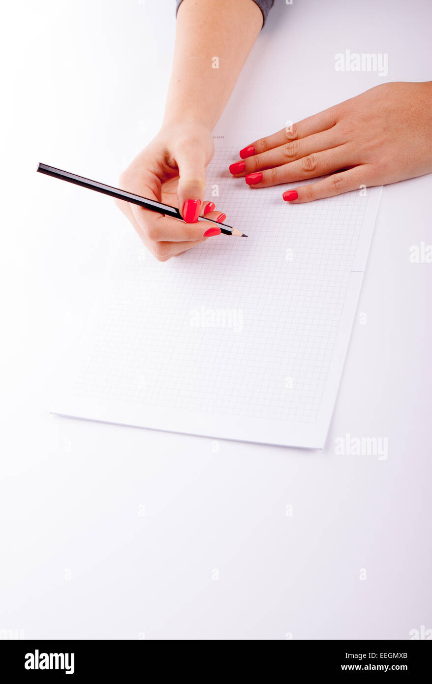 Woman writing with wooden pencil on white sheet Stock Photo - Alamy