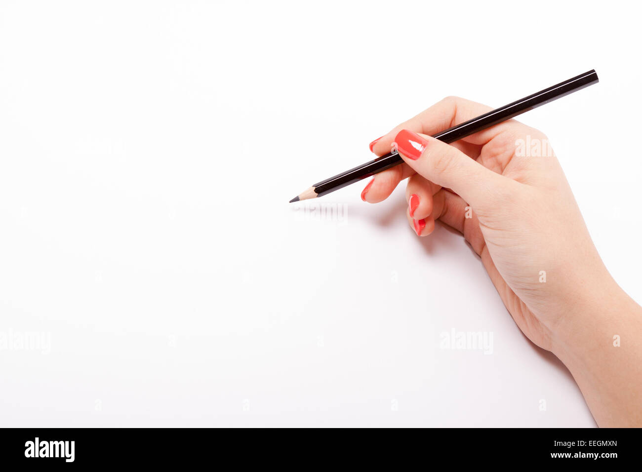 Woman writing with wooden pencil on white sheet Stock Photo - Alamy