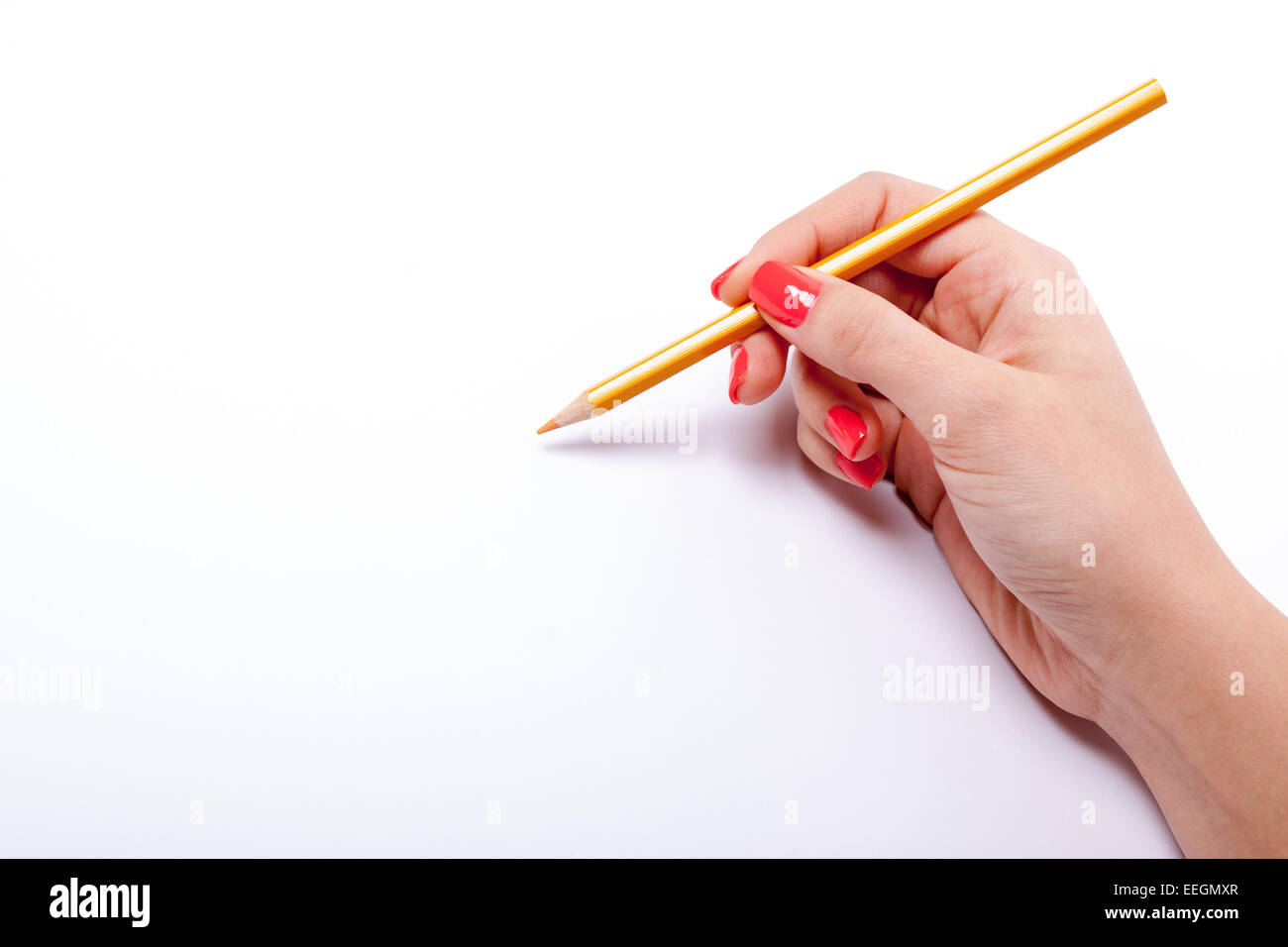 Woman writing with wooden pencil on white sheet Stock Photo - Alamy