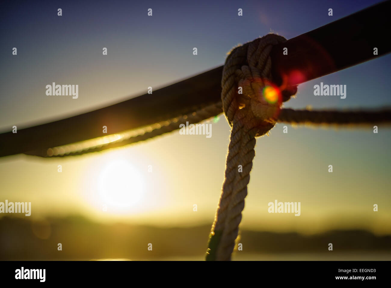 A boat mooring rope tied to a metal pole Stock Photo - Alamy
