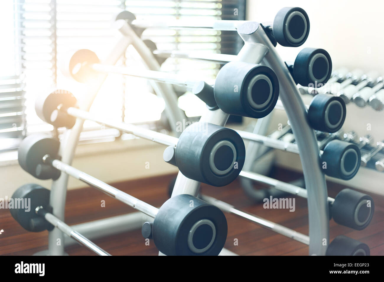 Bars in modern sports club. Weight training equipment Stock Photo - Alamy