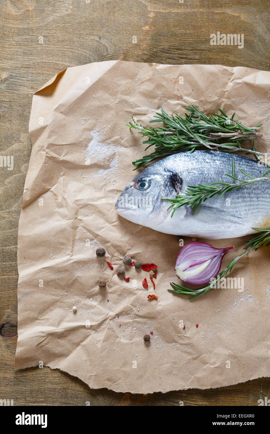 Dorado on the paper, seafood Stock Photo - Alamy