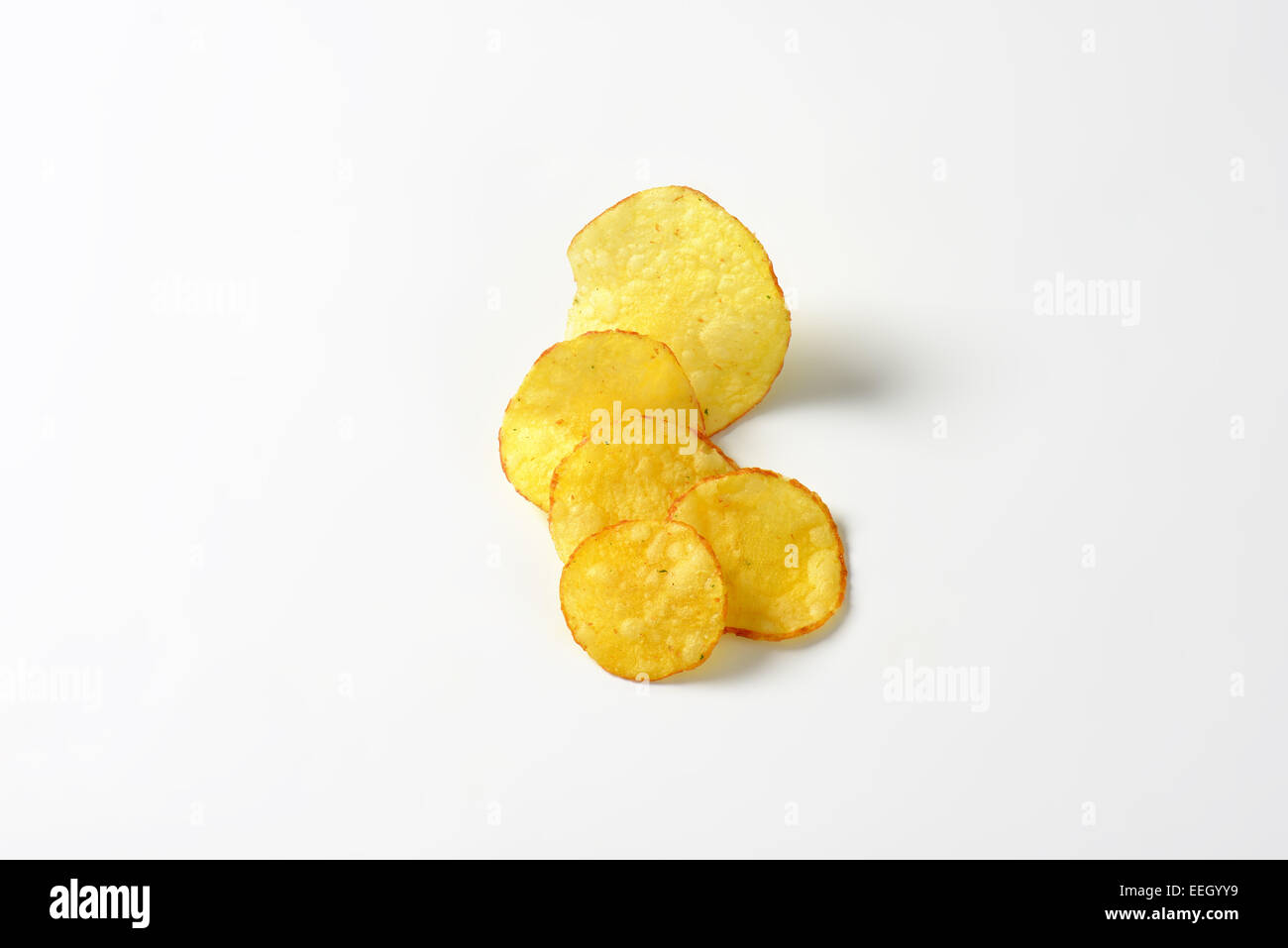 Heap of potato chips on white background Stock Photo - Alamy