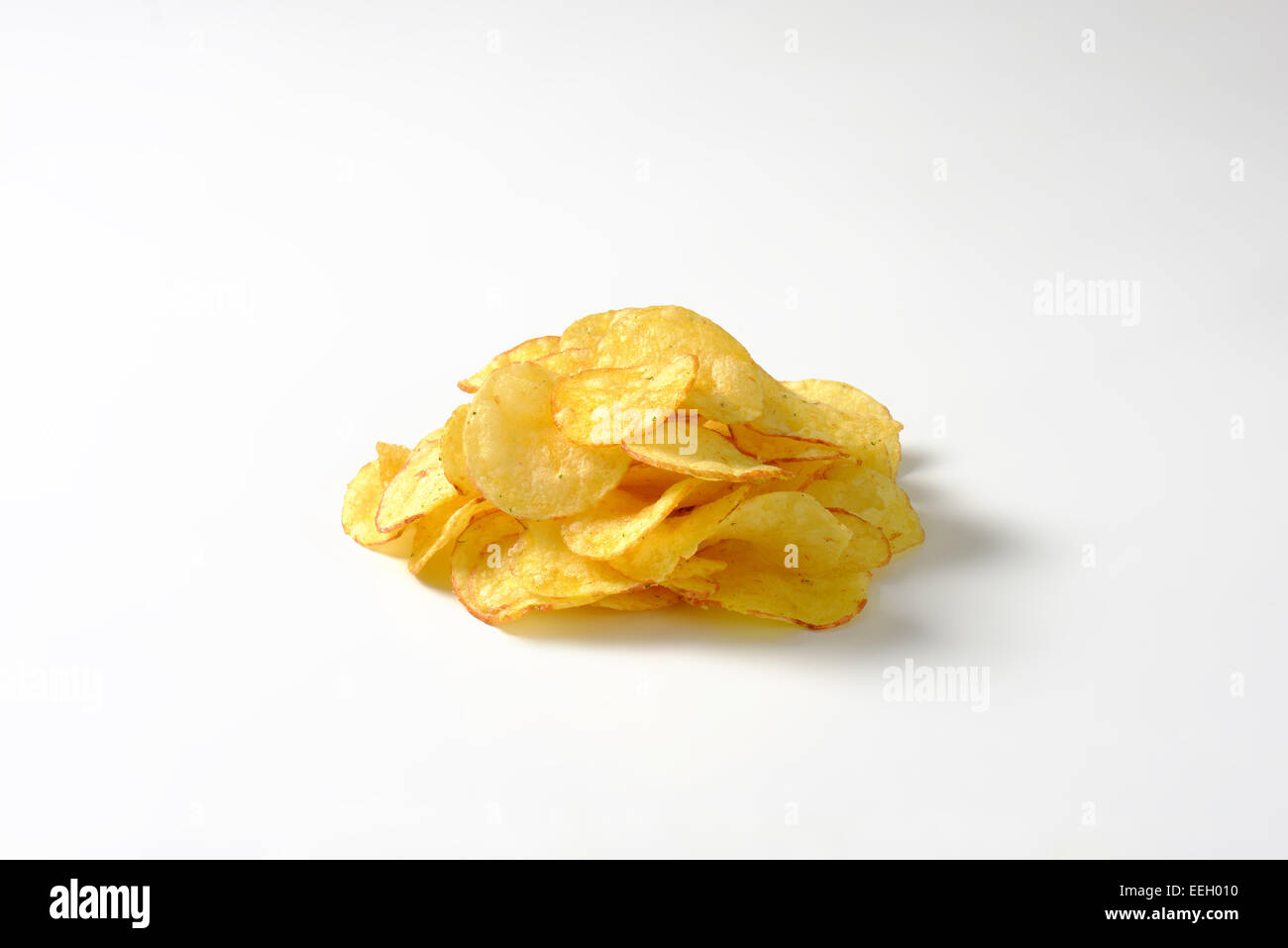 Heap of potato chips on white background Stock Photo - Alamy