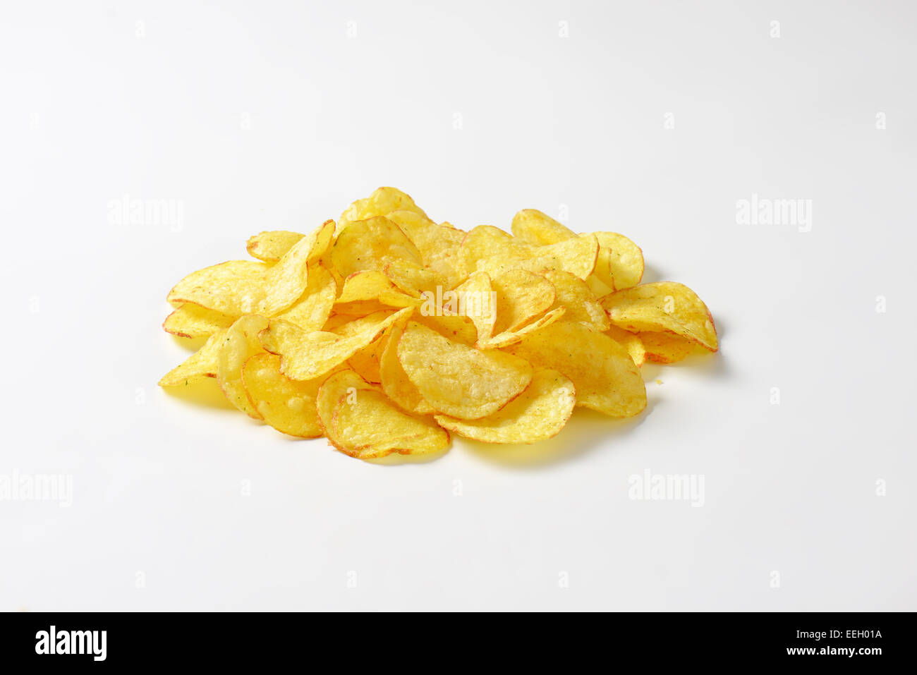 Heap of potato chips on white background Stock Photo - Alamy